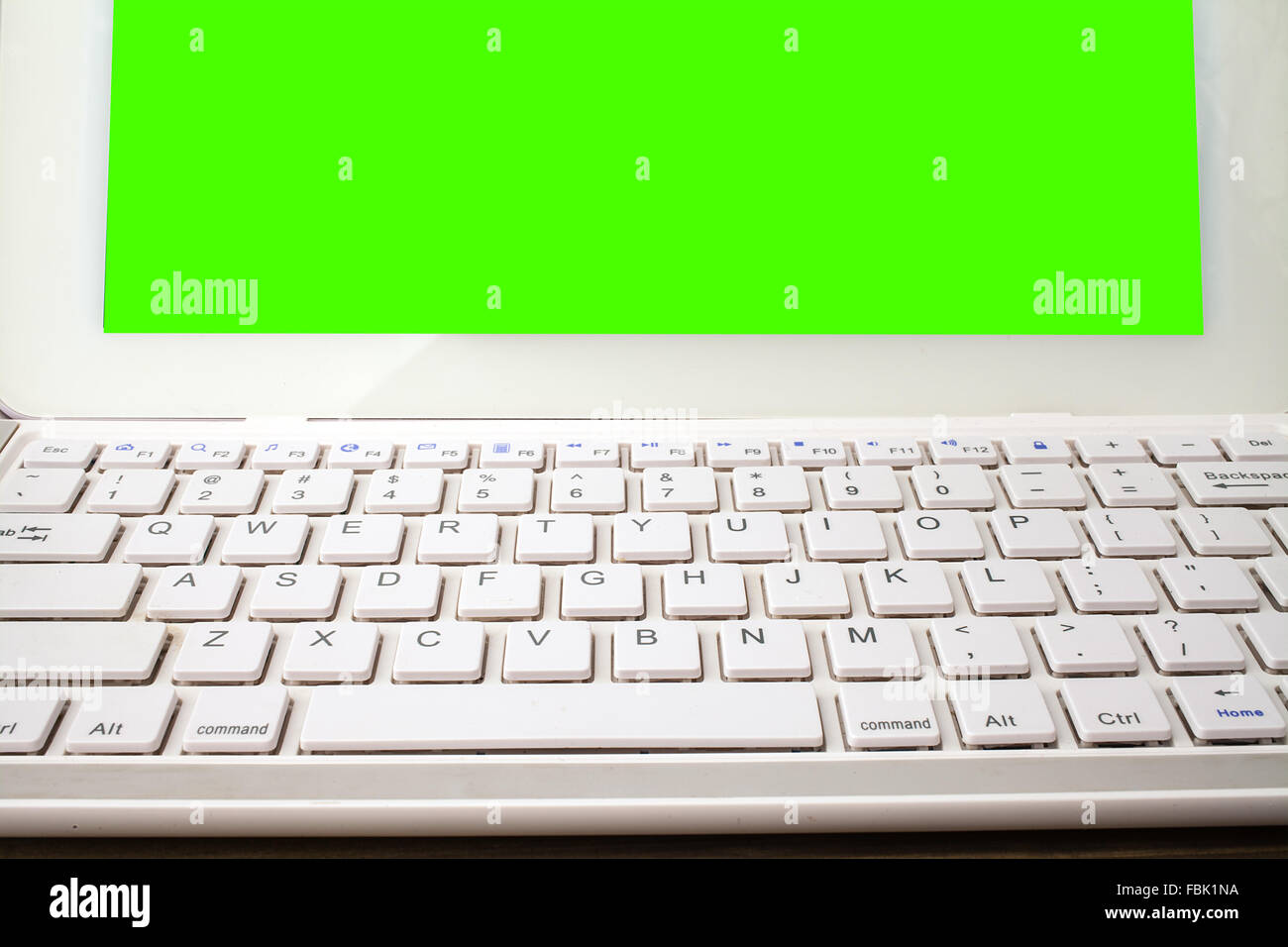 Open laptop isolated screen on old wooden desk Stock Photo - Alamy