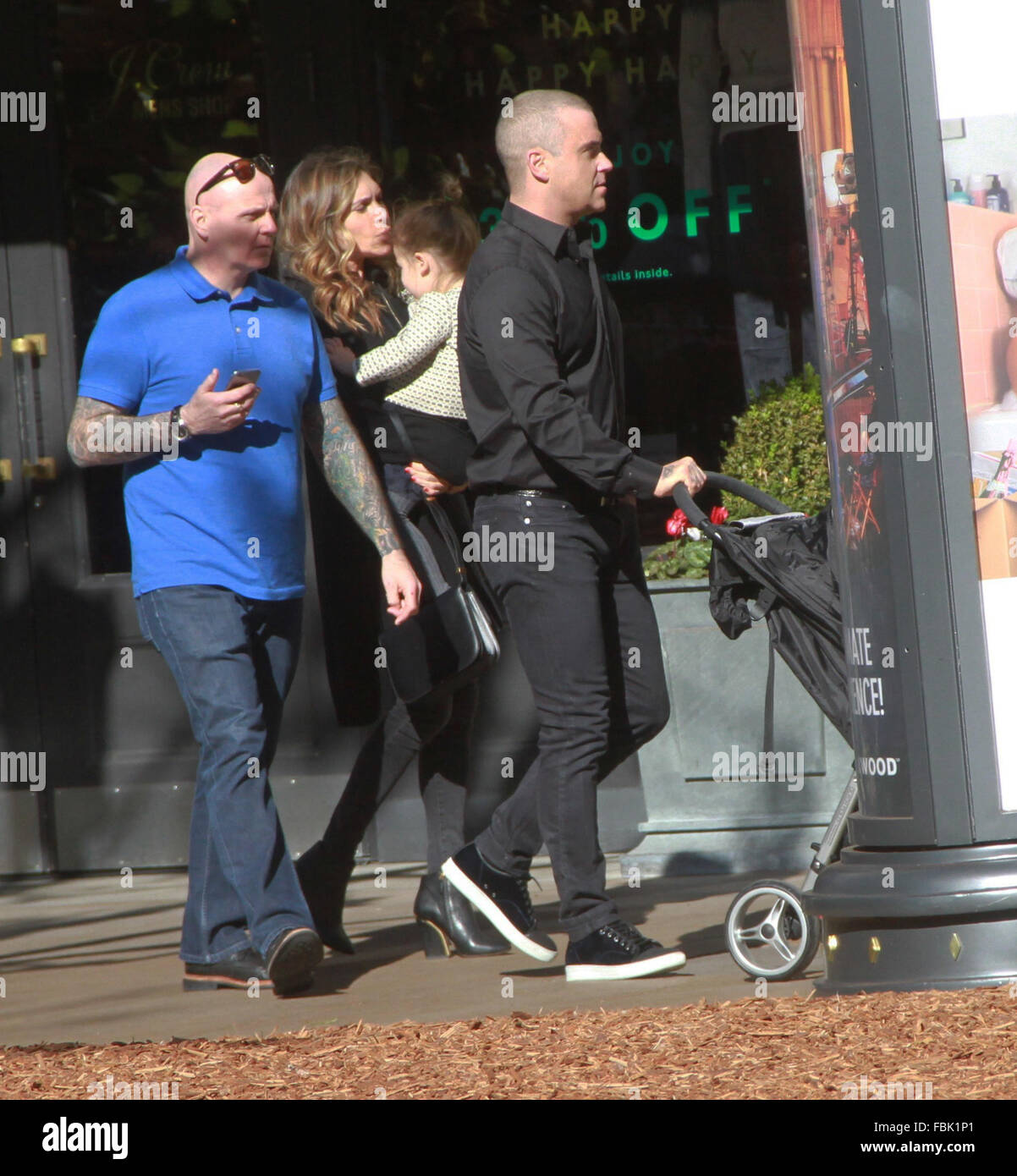 Robbie Williams takes his family shopping at The Grove in Hollywood ...