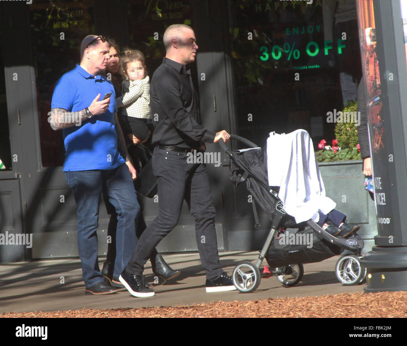Robbie Williams takes his family shopping at The Grove in Hollywood ...