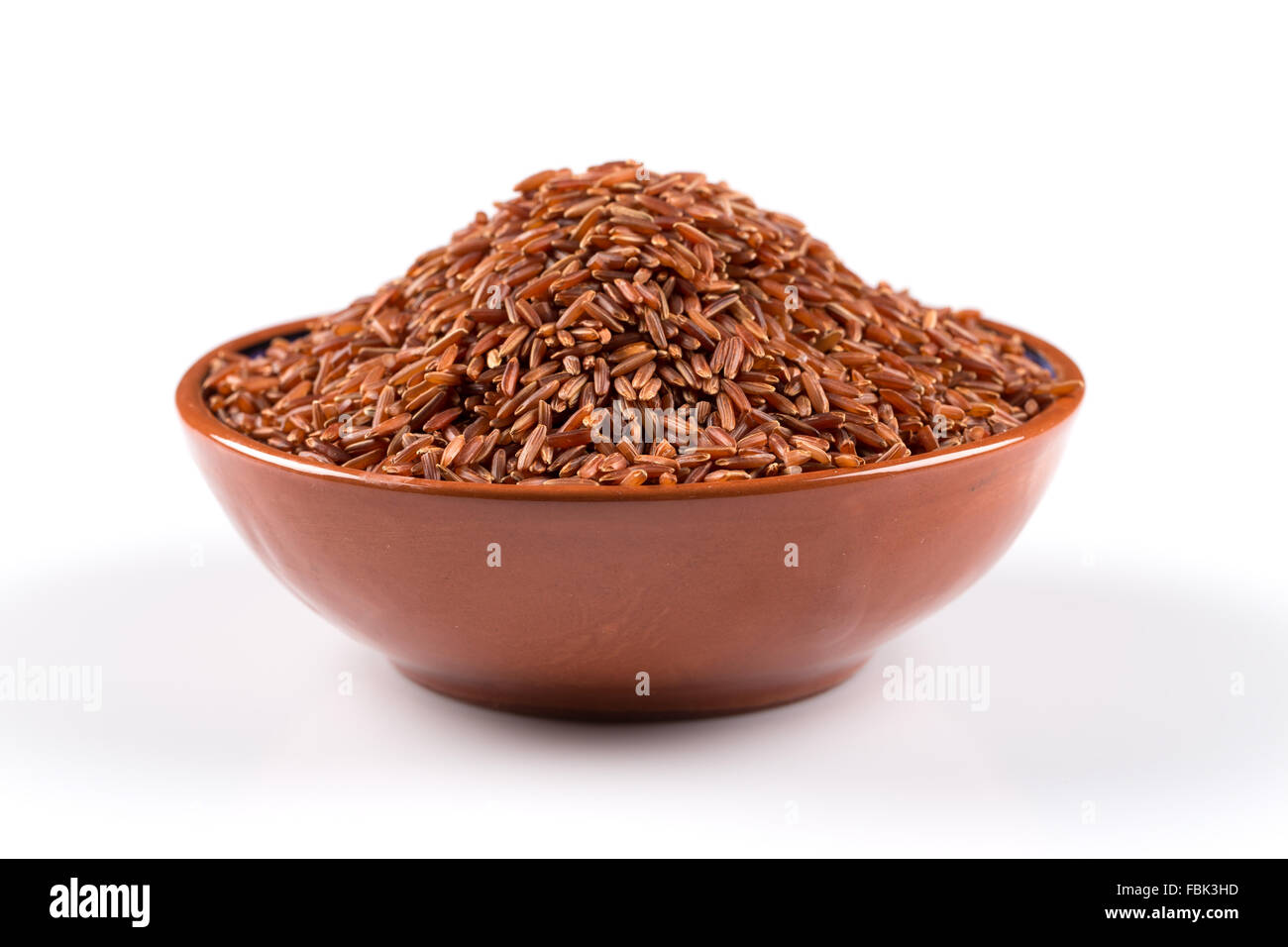 Bowl of Red Cargo Rice. Shot on white background Stock Photo - Alamy