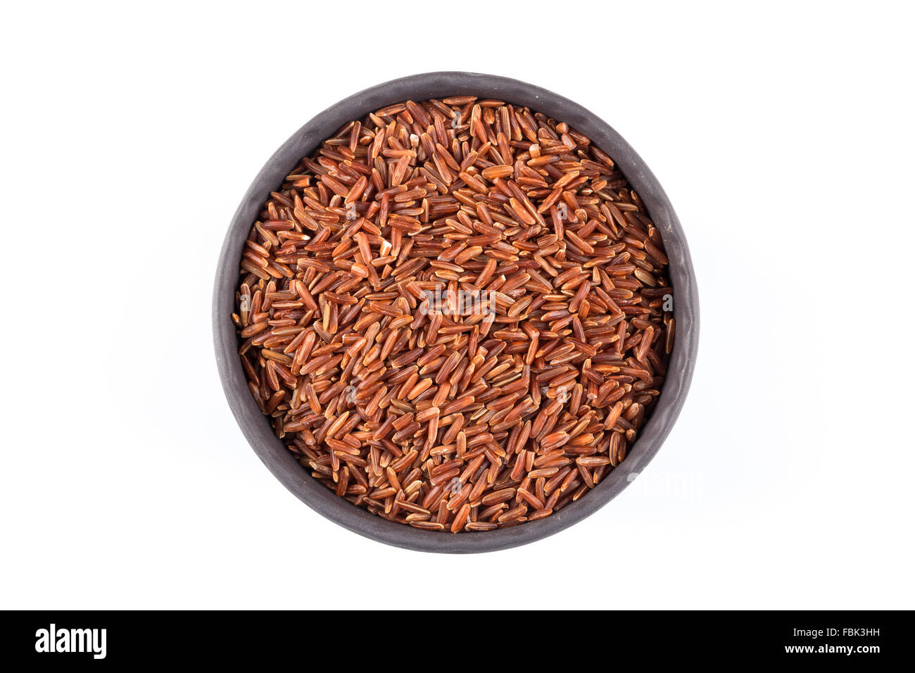 Bowl of Red Cargo Rice. Shot on white background Stock Photo - Alamy