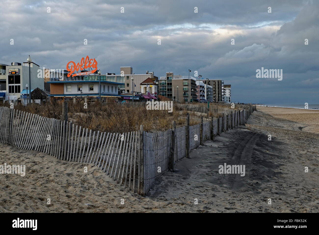 Rehoboth Beach, DE - View of boardwalk from the beach under overcast ...