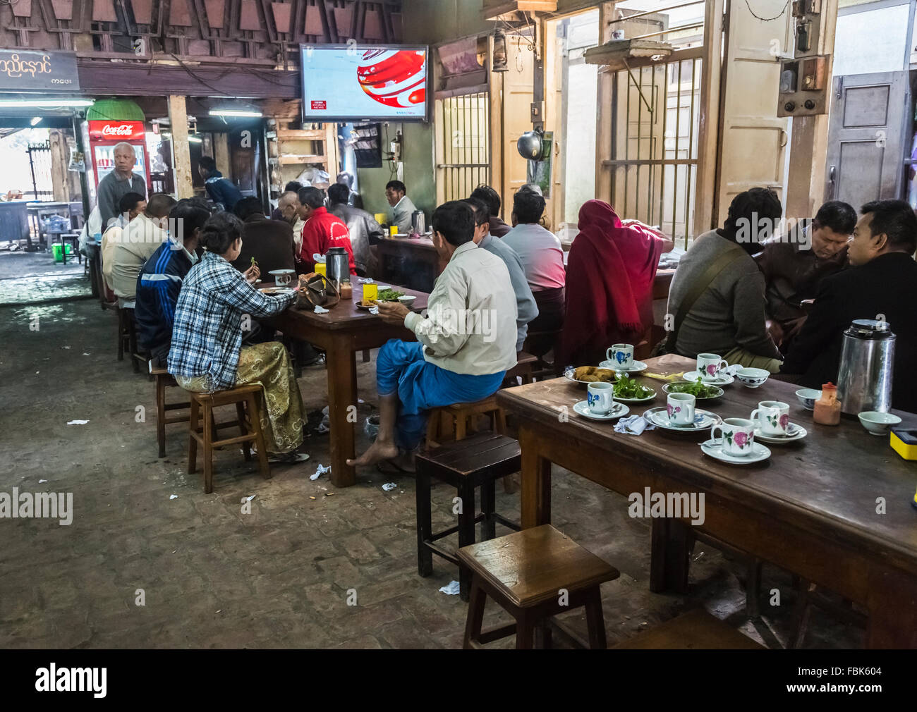 Interior of typical local tea rooms, local Burmese people eating ...