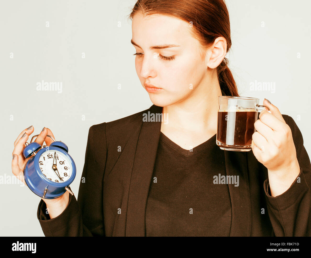 young beauty woman in business style costume waking up for work early ...