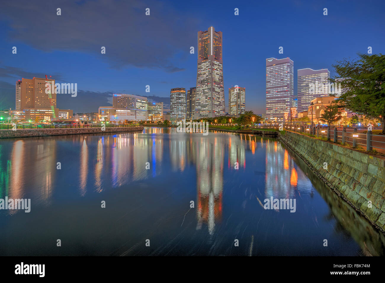 The reflection of Yokohama Landmark Tower and the surrounding modern ...