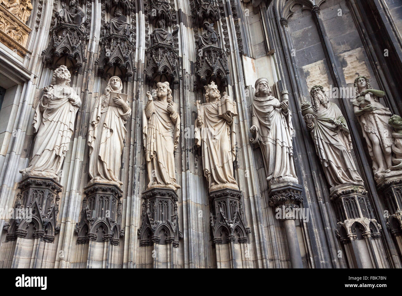 Details of stone figures on the facade of Cologne cathedral, Germany ...