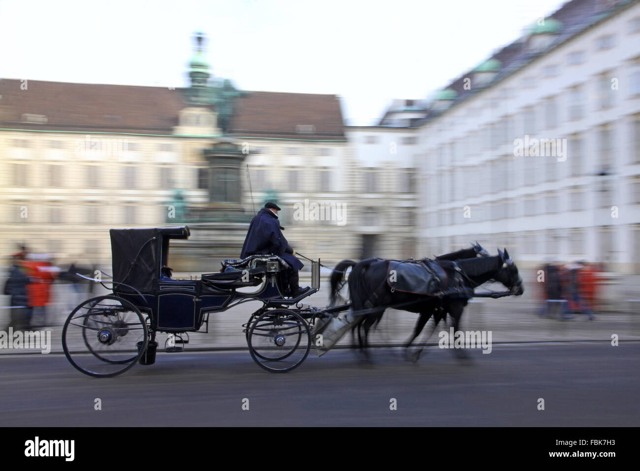 Horse-driven carriage at Hofburg palace, Vienna, Austria Stock Photo ...