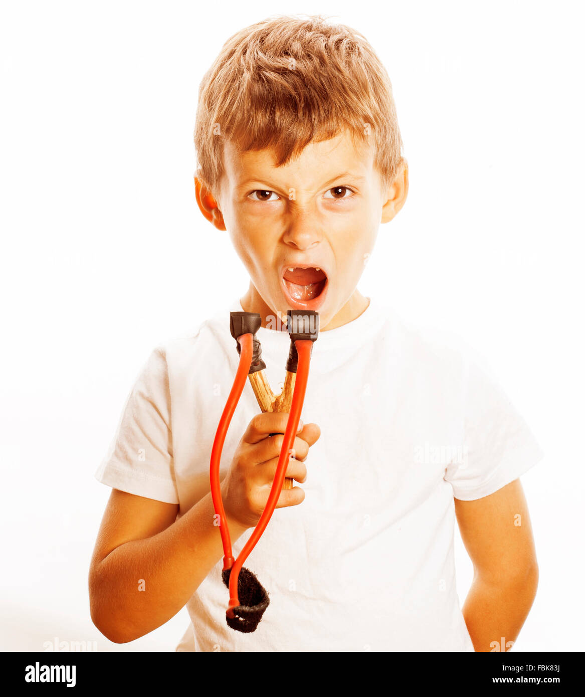 little cute angry real boy with slingshot isolated Stock Photo - Alamy