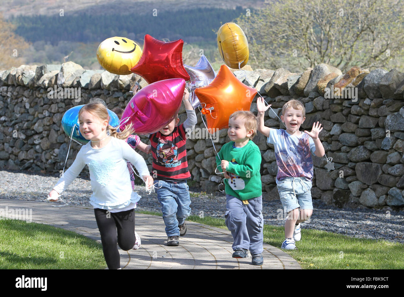Children playing at a nursery with balloons and having fun Stock Photo ...