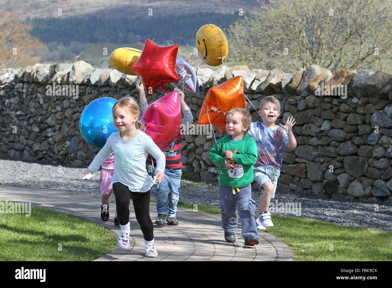 Children playing with balloons hi-res stock photography and images - Alamy