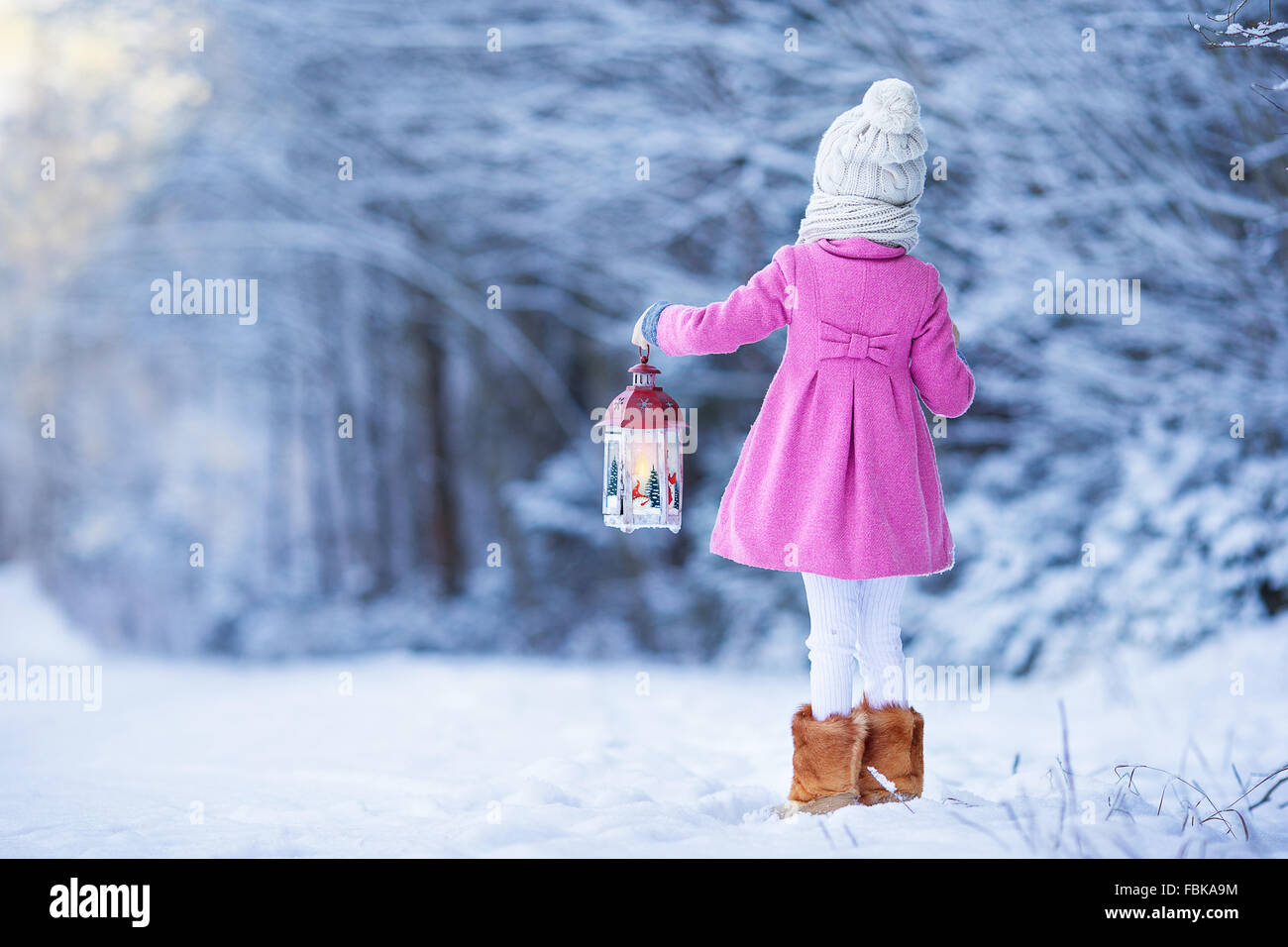 Back view of adorable girl with flashlight on Christmas outdoors Stock ...
