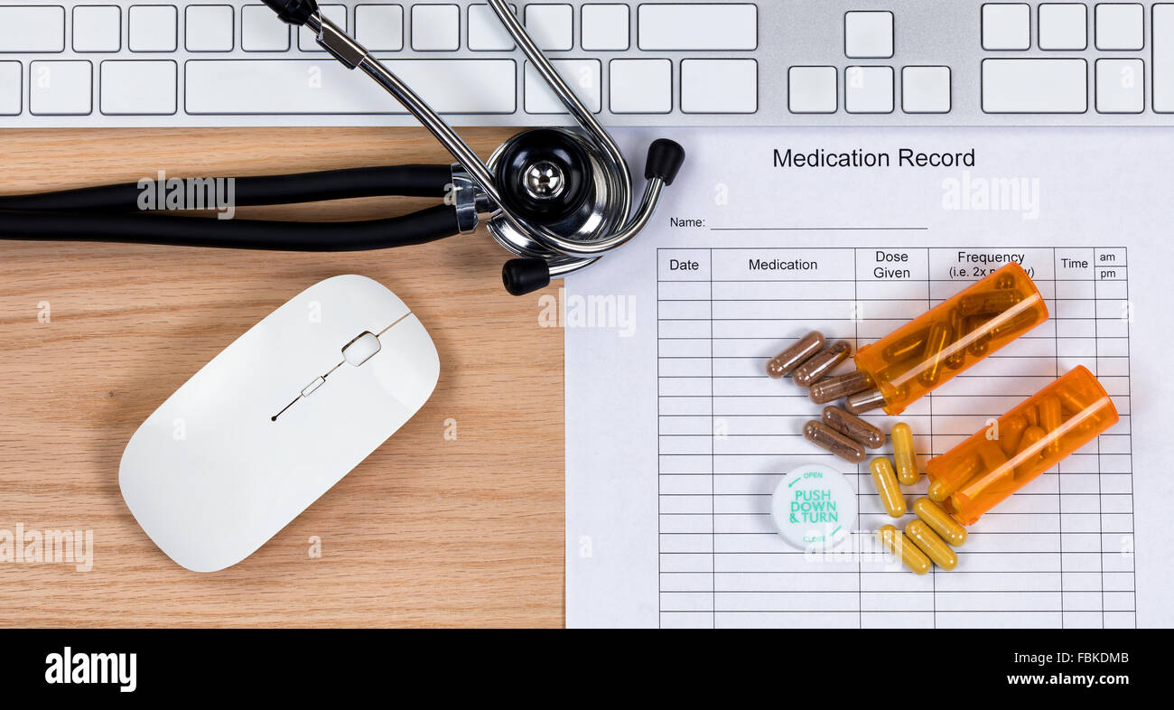 Patient medication record form with stethoscope, medication container ...