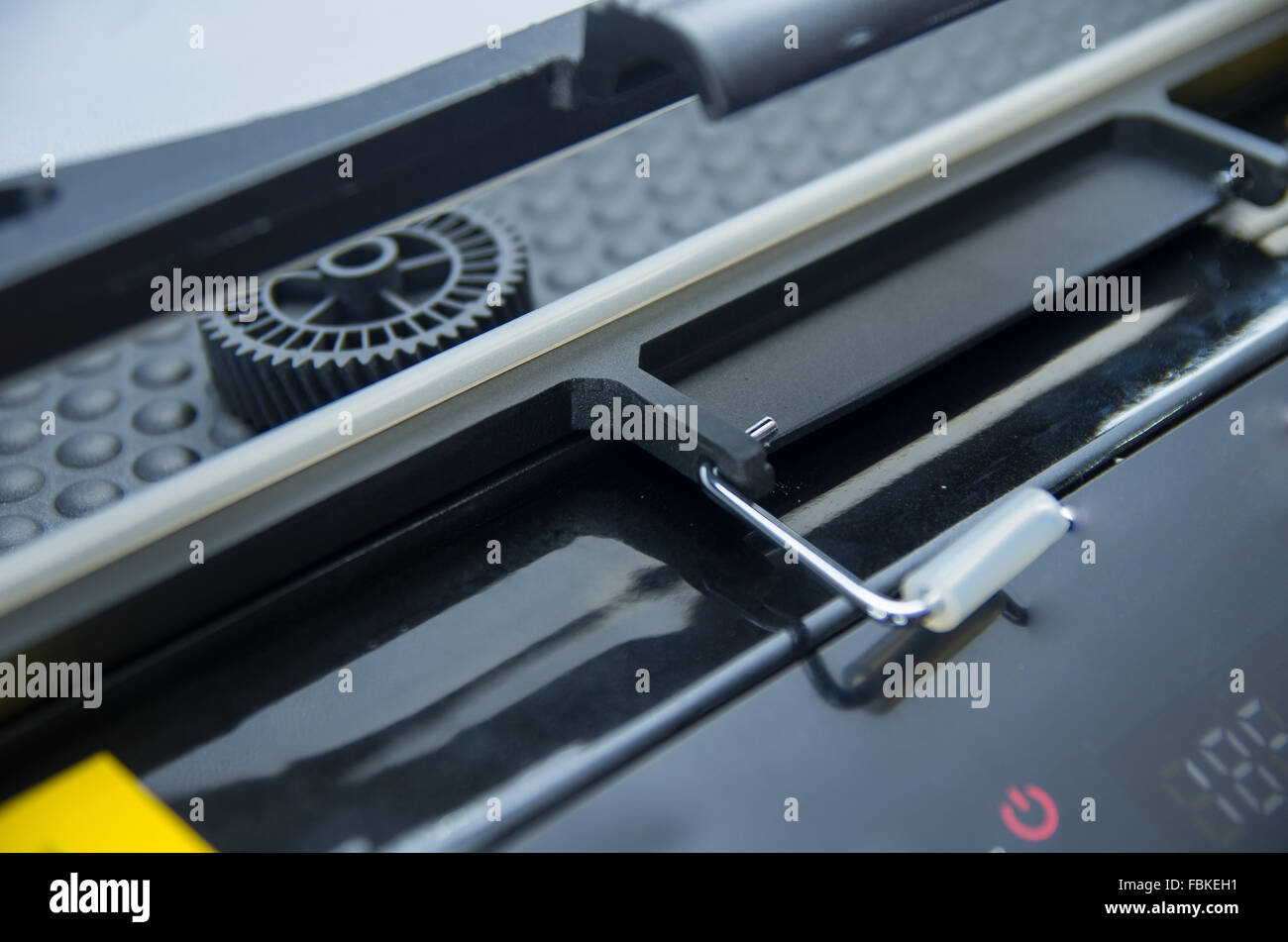 Closeup black print screen machine showing mechanical details in ...