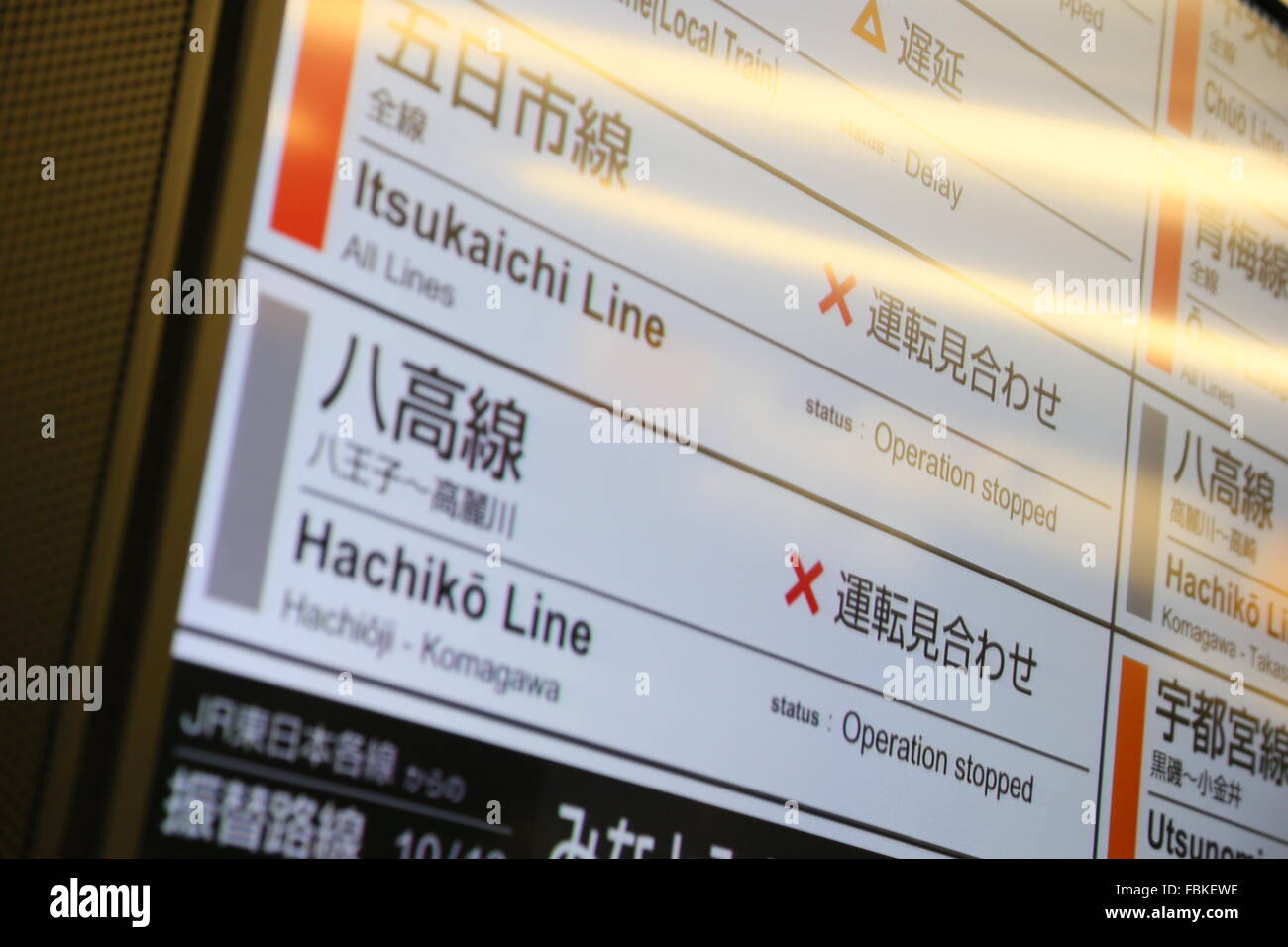 A Tokyo Station signboard shows train delays due to snow as on January ...
