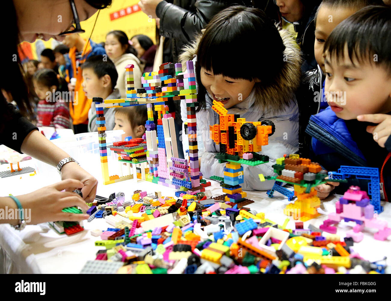 Shanghai, China. 17th Jan, 2016. Children watch a participant competing ...
