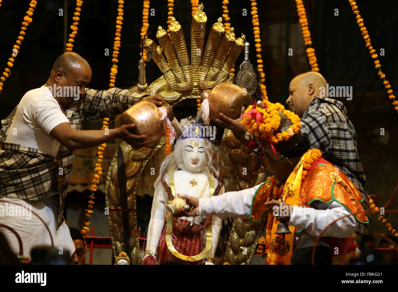 Kathmandu, Nepal. 17th Jan, 2016. Priests bath an idol of Seto ...