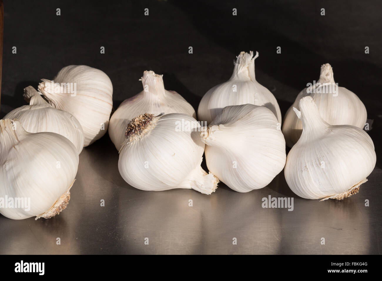 Garlic on a reflective surface Stock Photo - Alamy