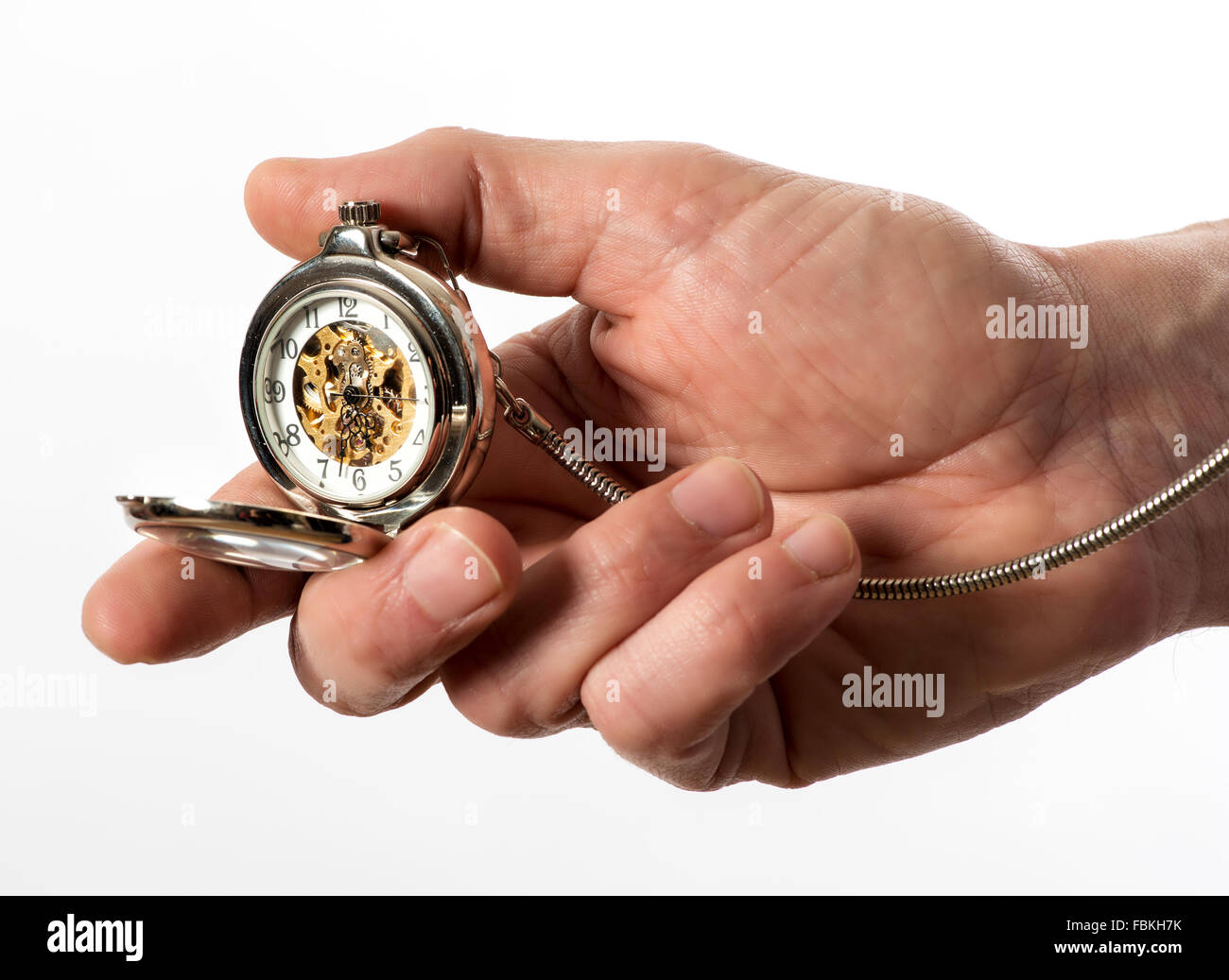 Man holding a vintage silver full hunter pocket watch in his hand ...