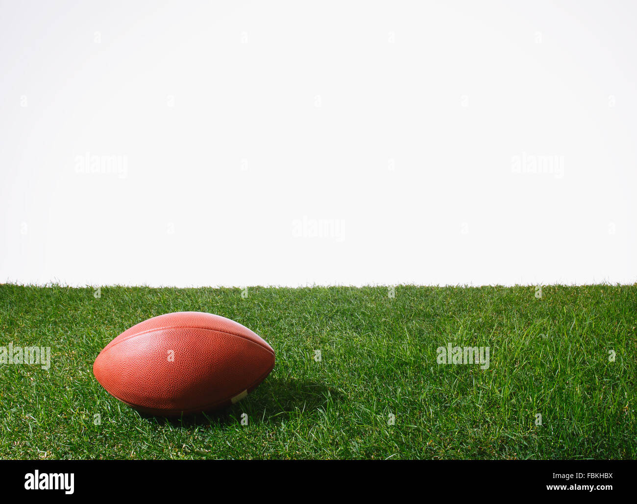 Football ball on grass hi-res stock photography and images - Alamy