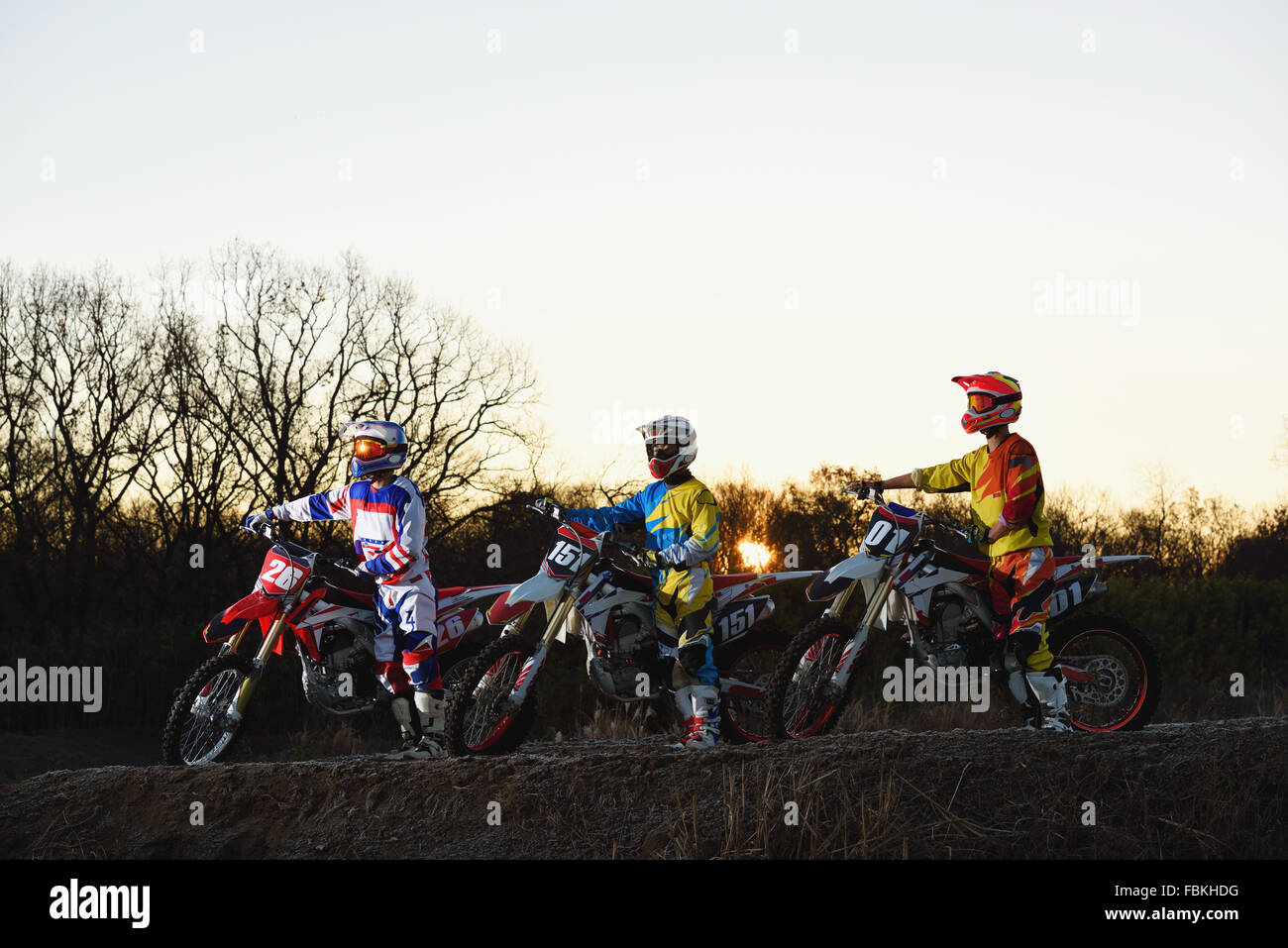 Motocross bikers on dirt track Stock Photo - Alamy