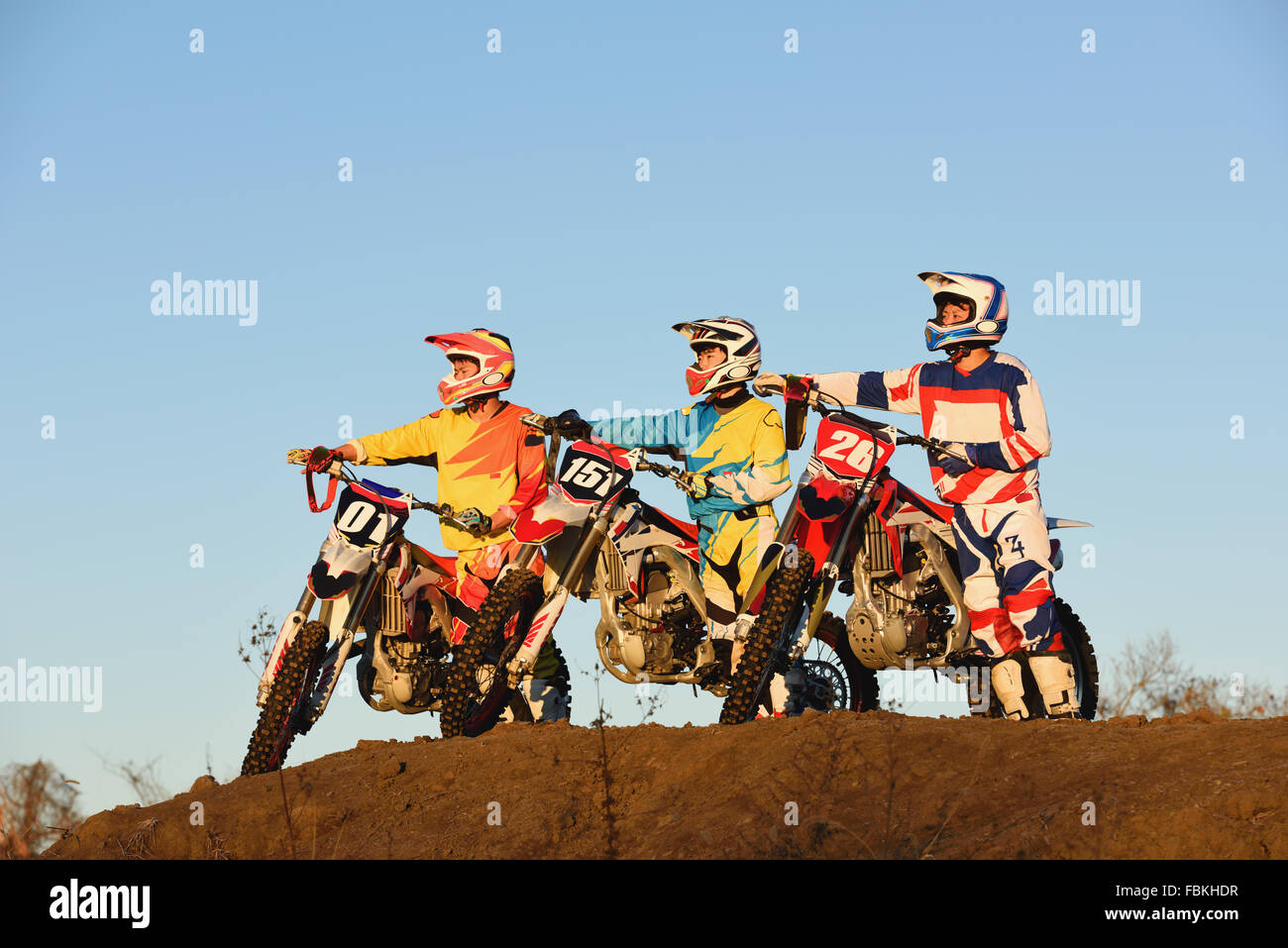 Motocross bikers on dirt track Stock Photo - Alamy