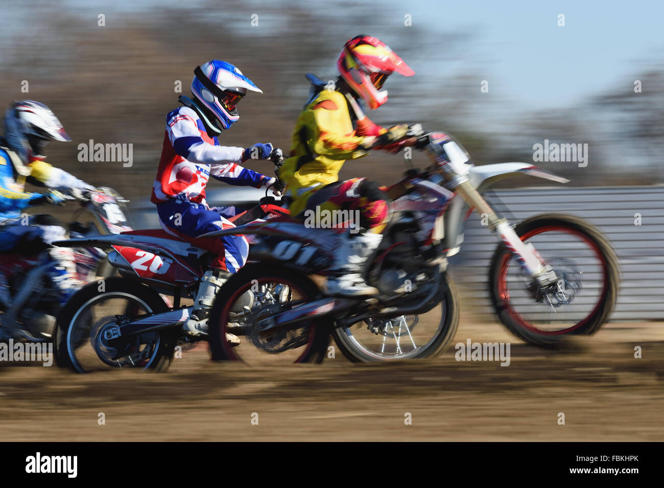 Motocross bikers on dirt track Stock Photo - Alamy