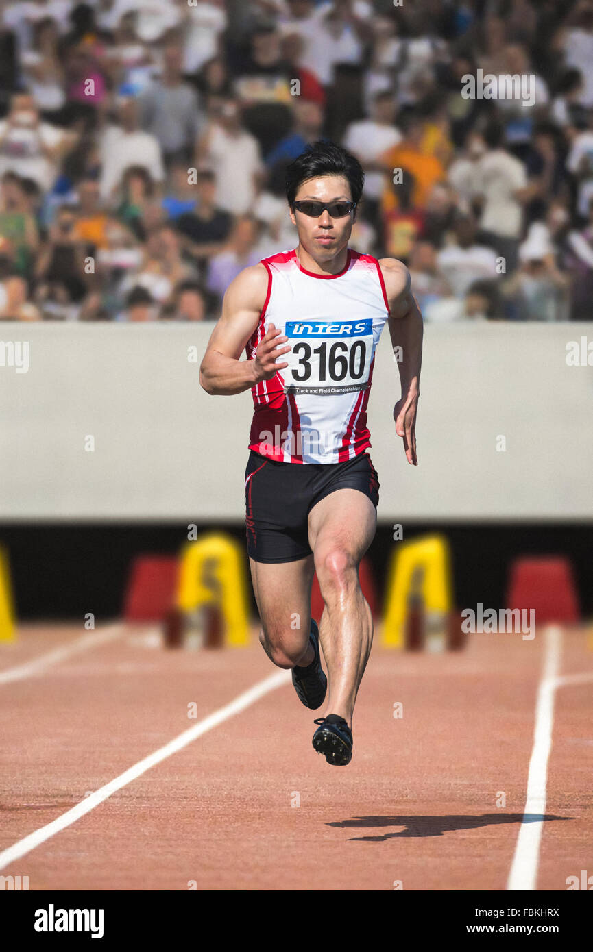 Japanese male sprinter running on track Stock Photo - Alamy