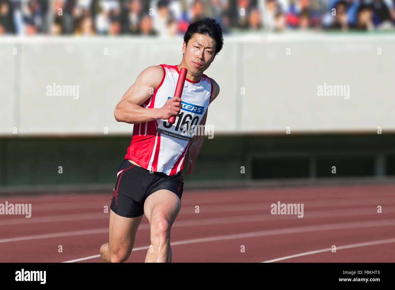 Japanese male sprinter running on track Stock Photo - Alamy