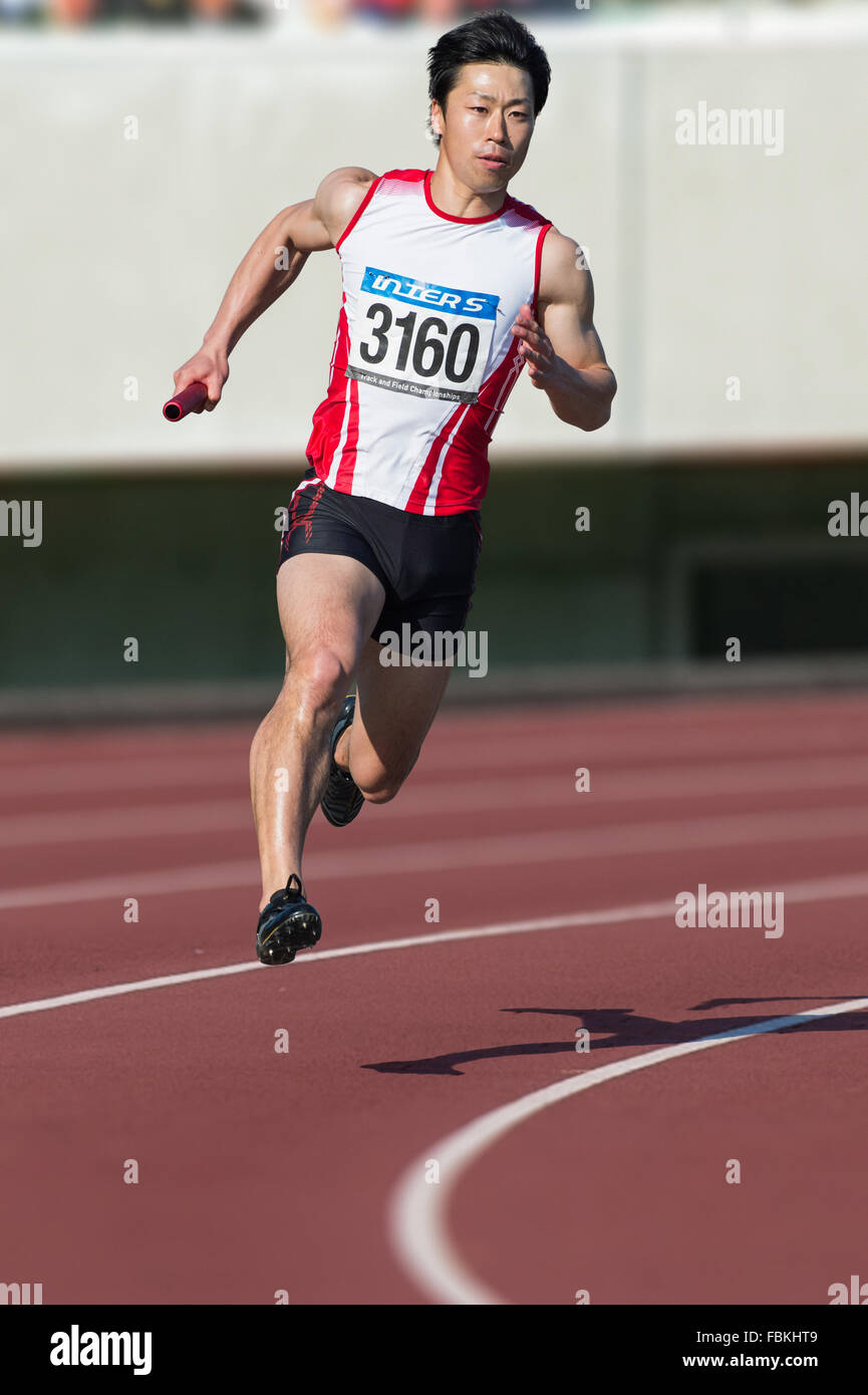 Japanese male sprinter running on track Stock Photo - Alamy