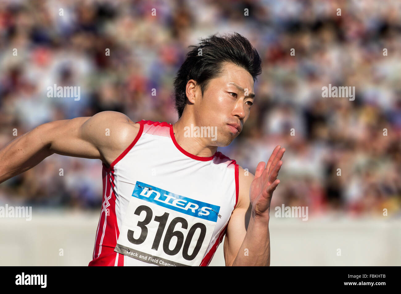 Japanese male sprinter running on track Stock Photo - Alamy