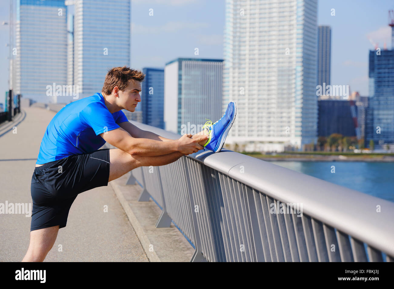 Young male stretching in hi-res stock photography and images - Alamy