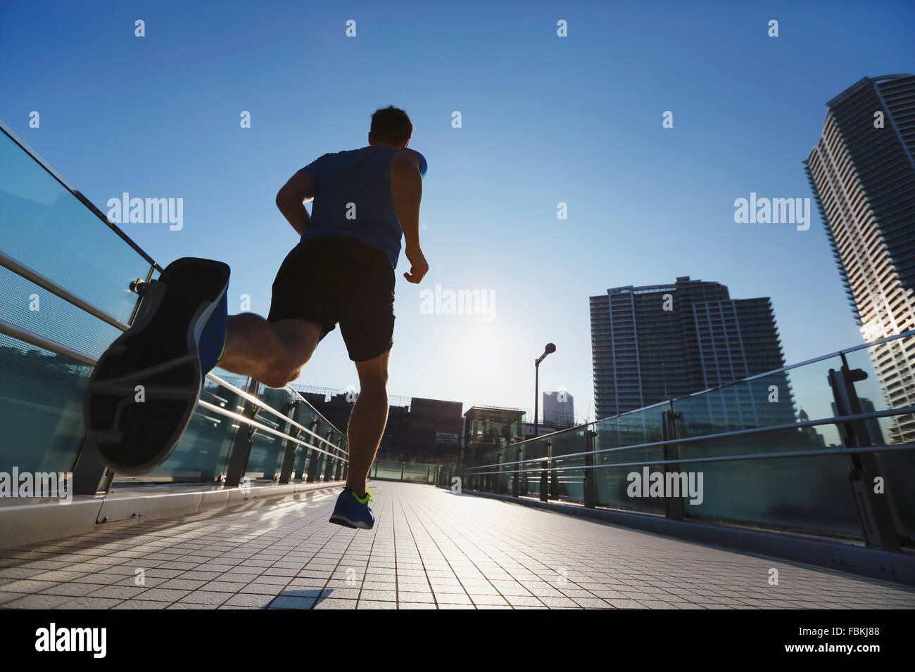 Young man silhouette running hi-res stock photography and images - Alamy