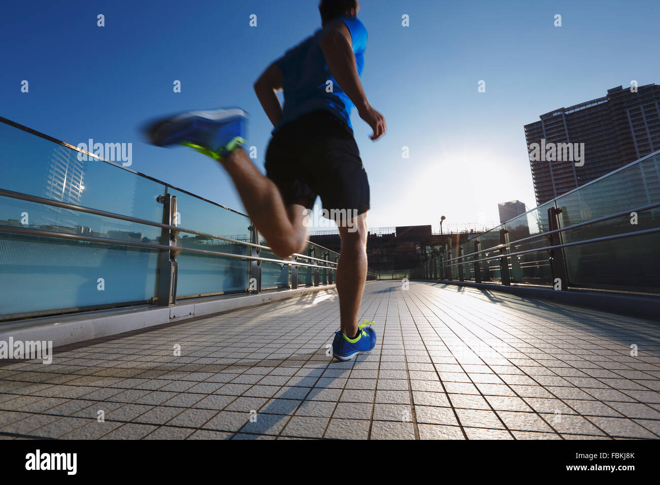 Rear view young man running hi-res stock photography and images - Alamy