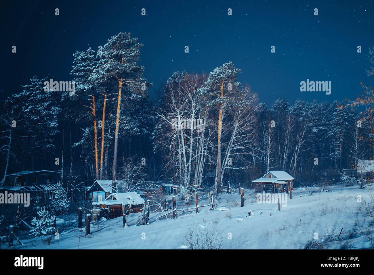 Small forest village covered by snow Stock Photo - Alamy