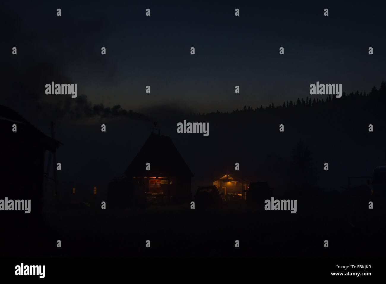 Small forest village covered by snow Stock Photo - Alamy