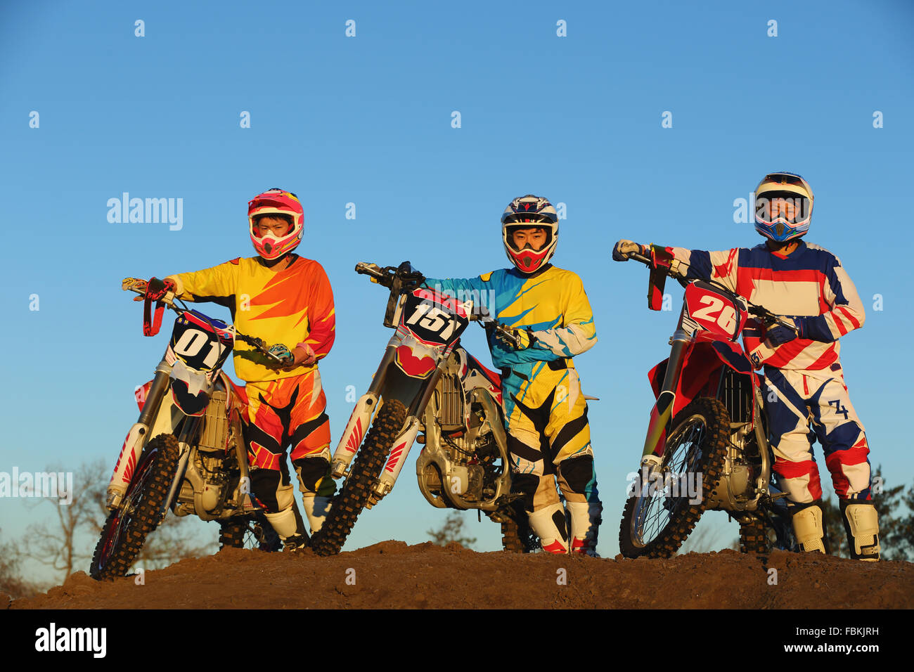 Motocross bikers on dirt track Stock Photo - Alamy