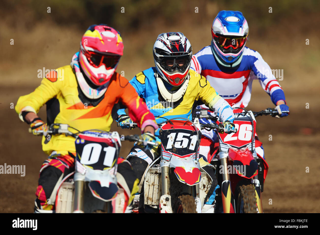 Motocross bikers on dirt track Stock Photo - Alamy