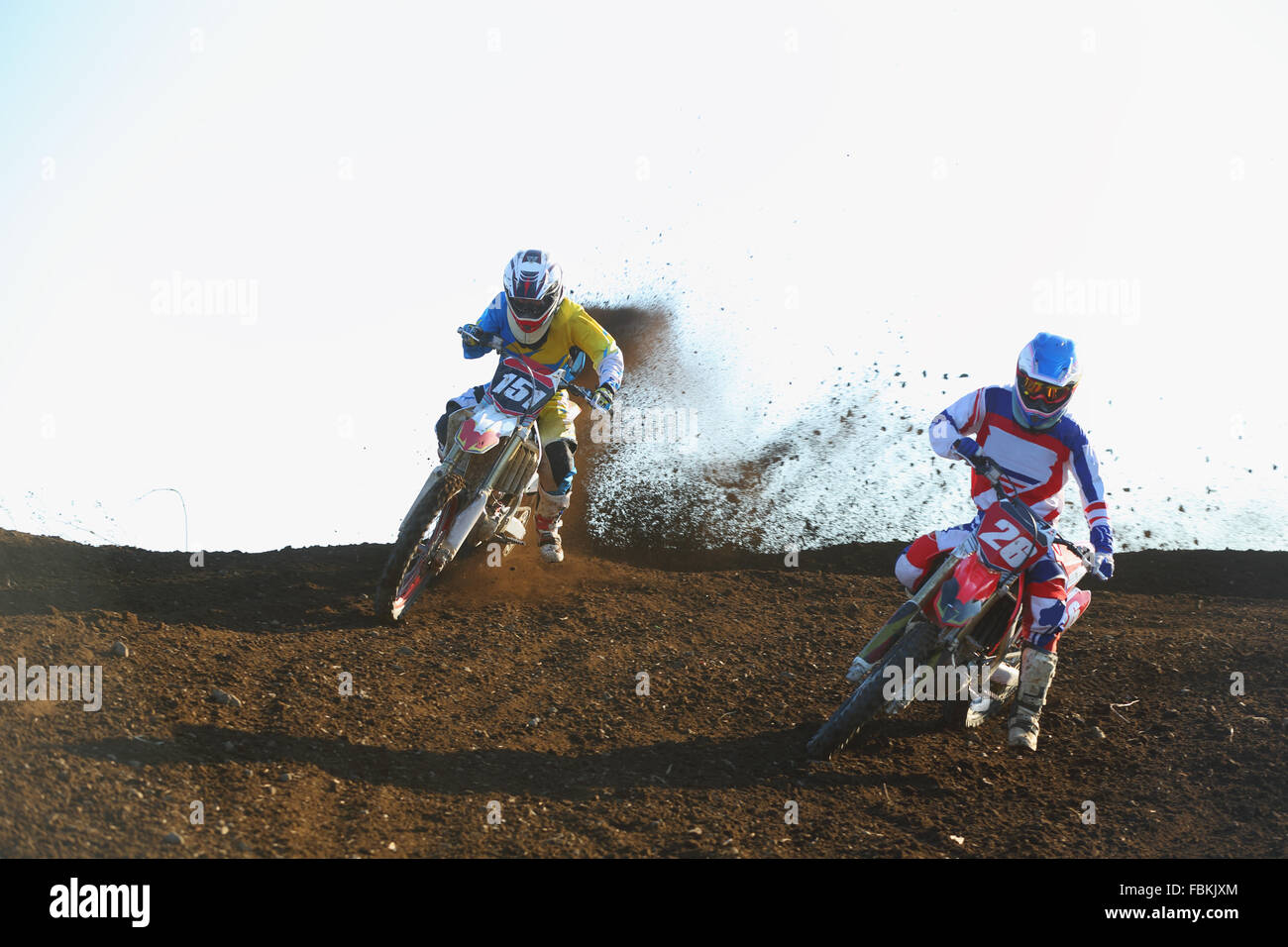 Motocross bikers on dirt track Stock Photo - Alamy