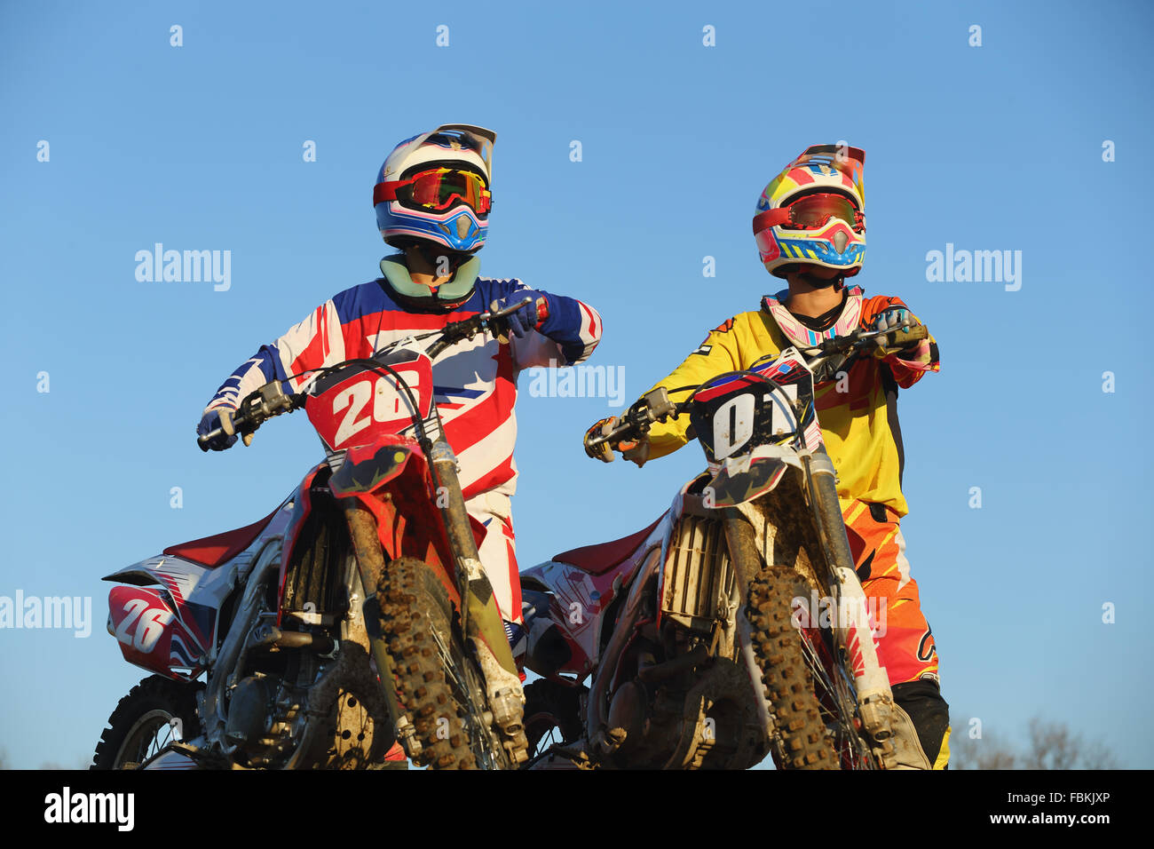 Motocross bikers on dirt track Stock Photo - Alamy