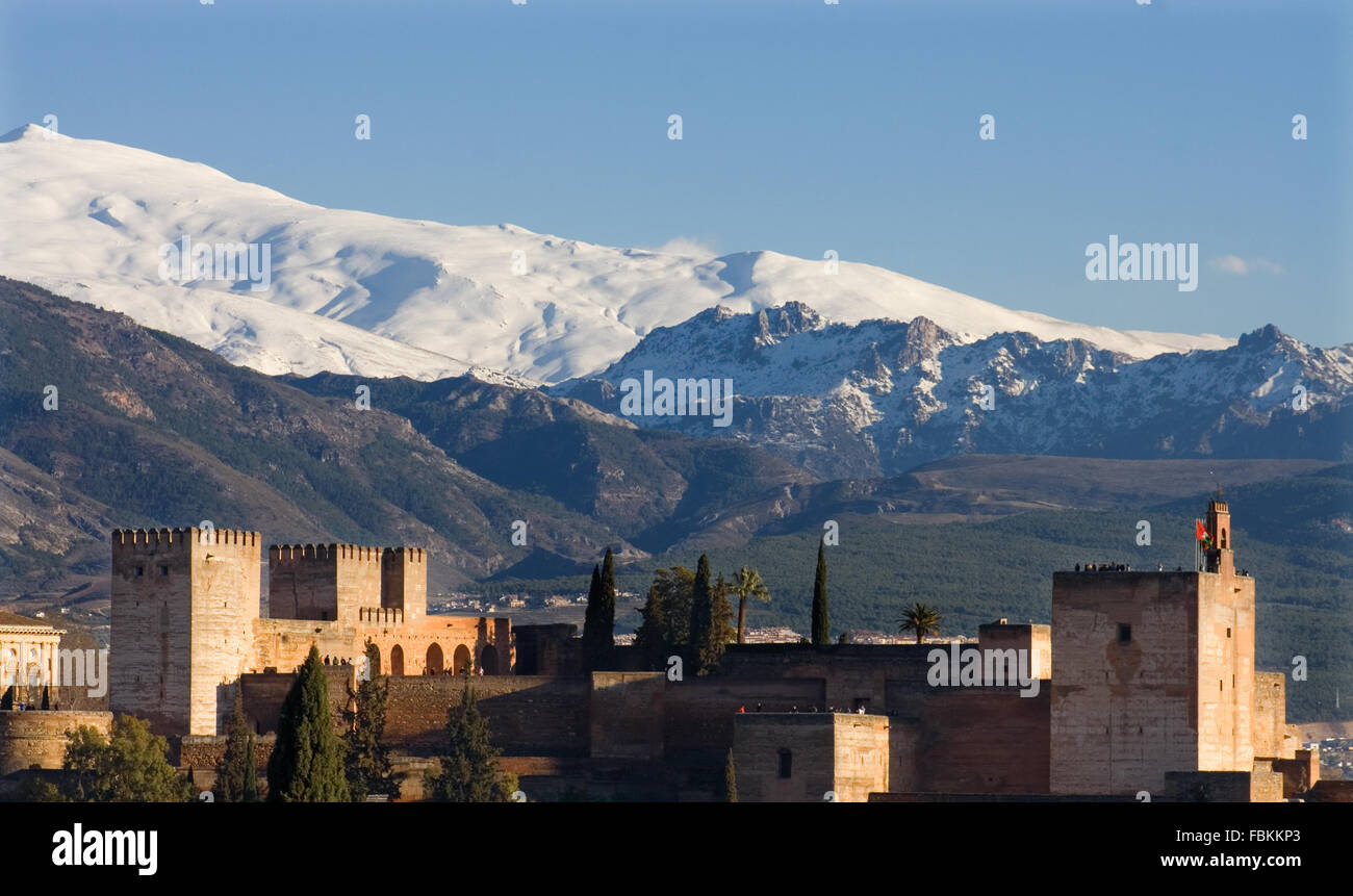 The Alhambra of Granada in Spain with Sierra Nevada snowy mountains as ...