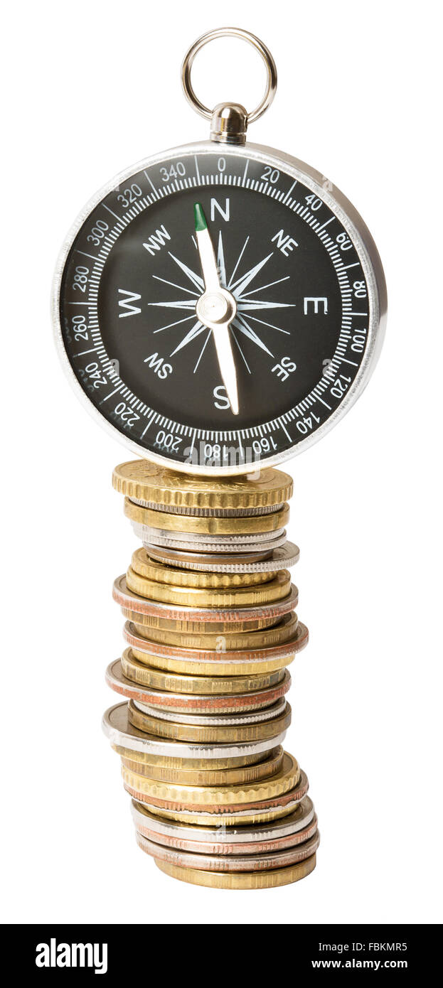 Compass on stack of coins Stock Photo - Alamy