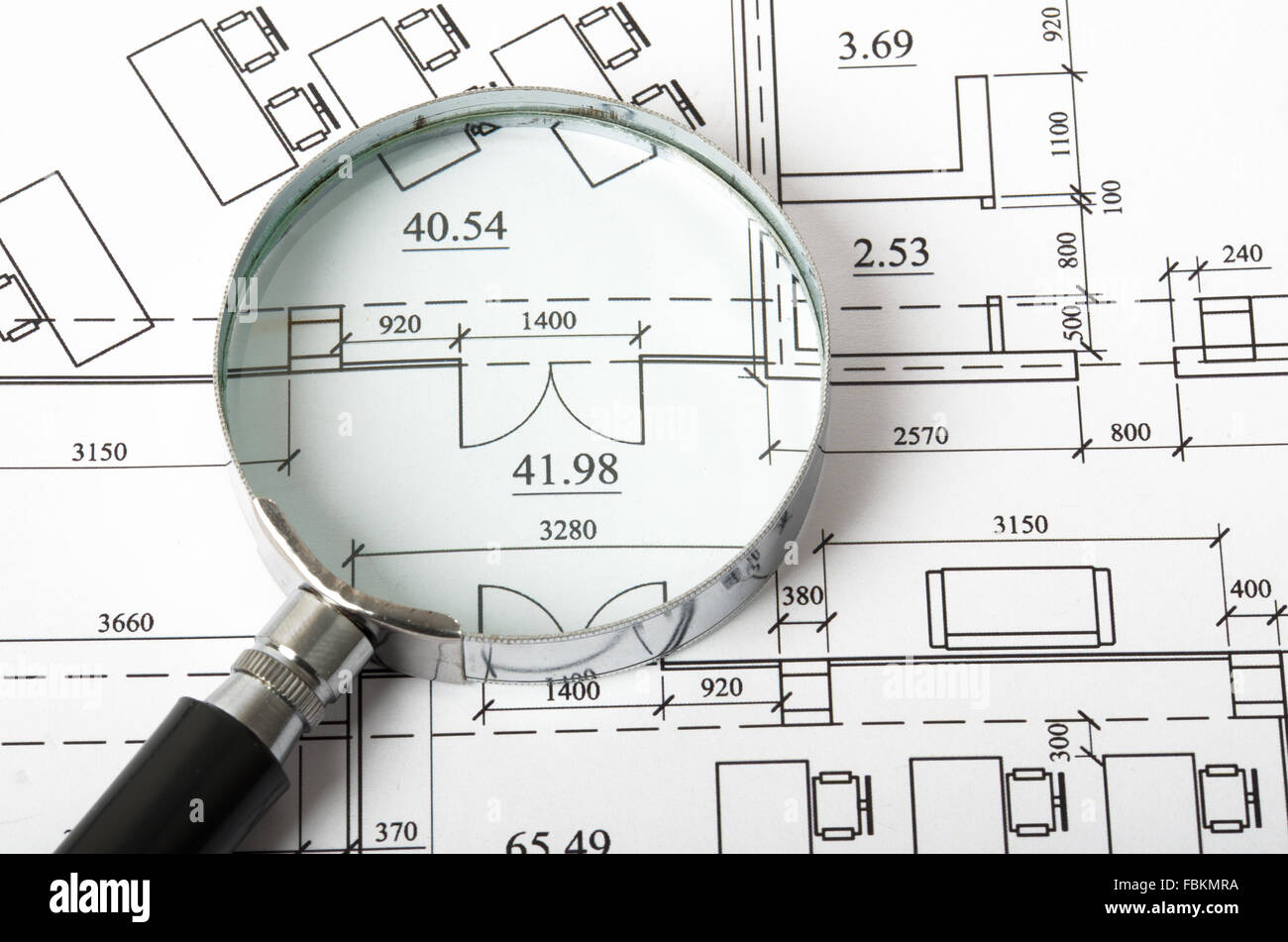 Magnifier on blueprints Stock Photo - Alamy