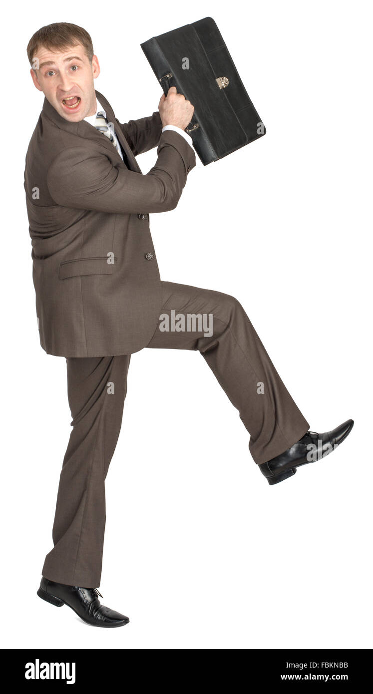 Scared businessman with briefcase Stock Photo - Alamy