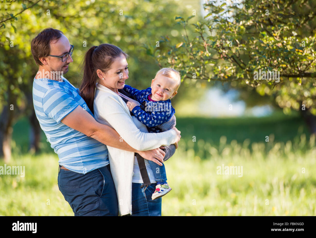 Happy family in nature Stock Photo - Alamy