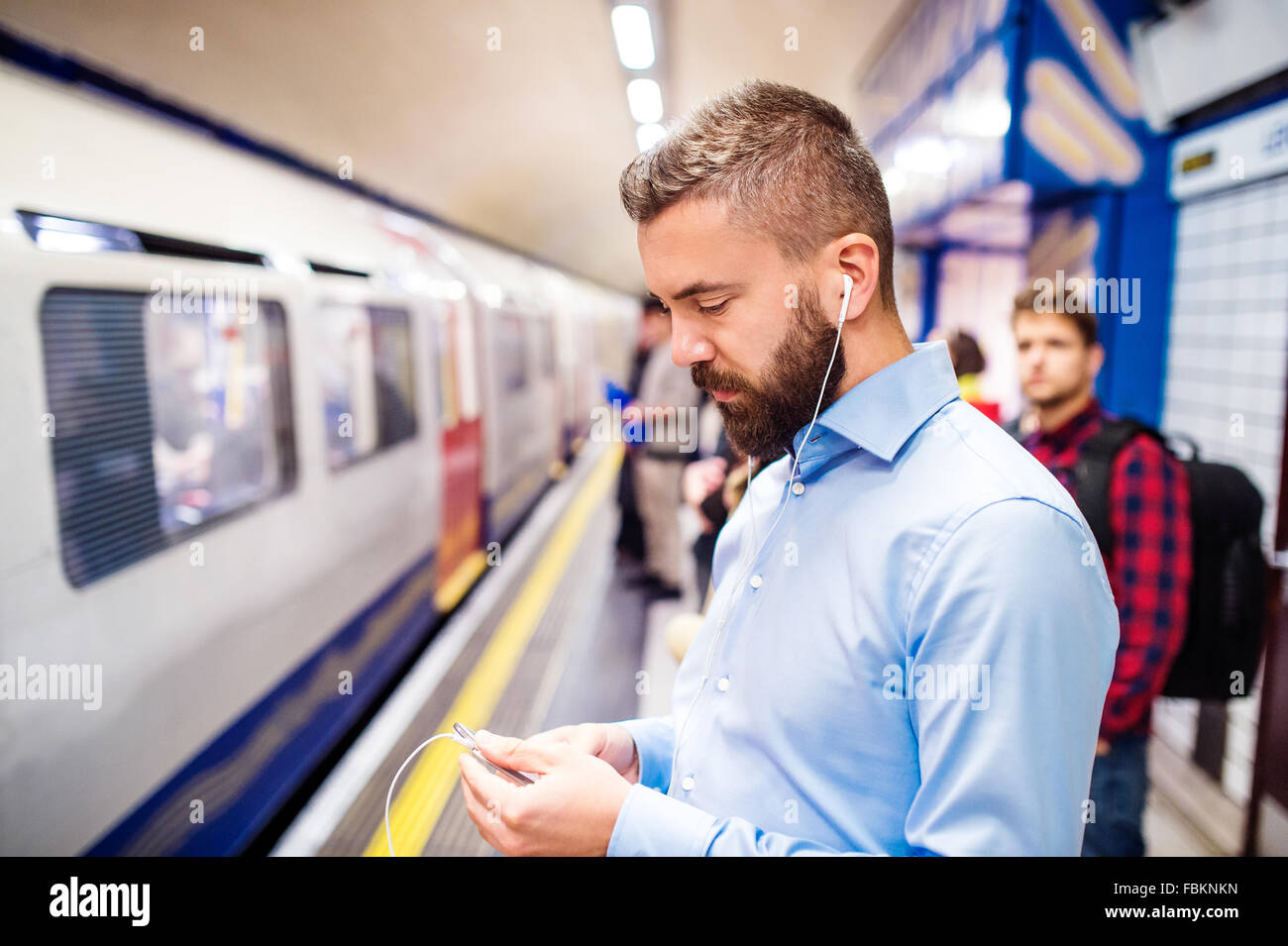 Young men in subway Stock Photo - Alamy