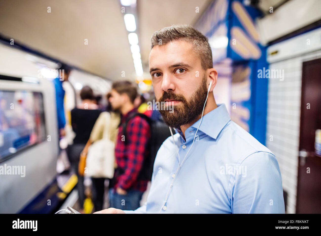Young man in subway Stock Photo - Alamy