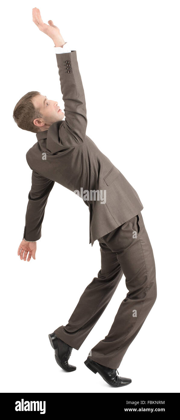 Businessman posing with arm raised Stock Photo - Alamy