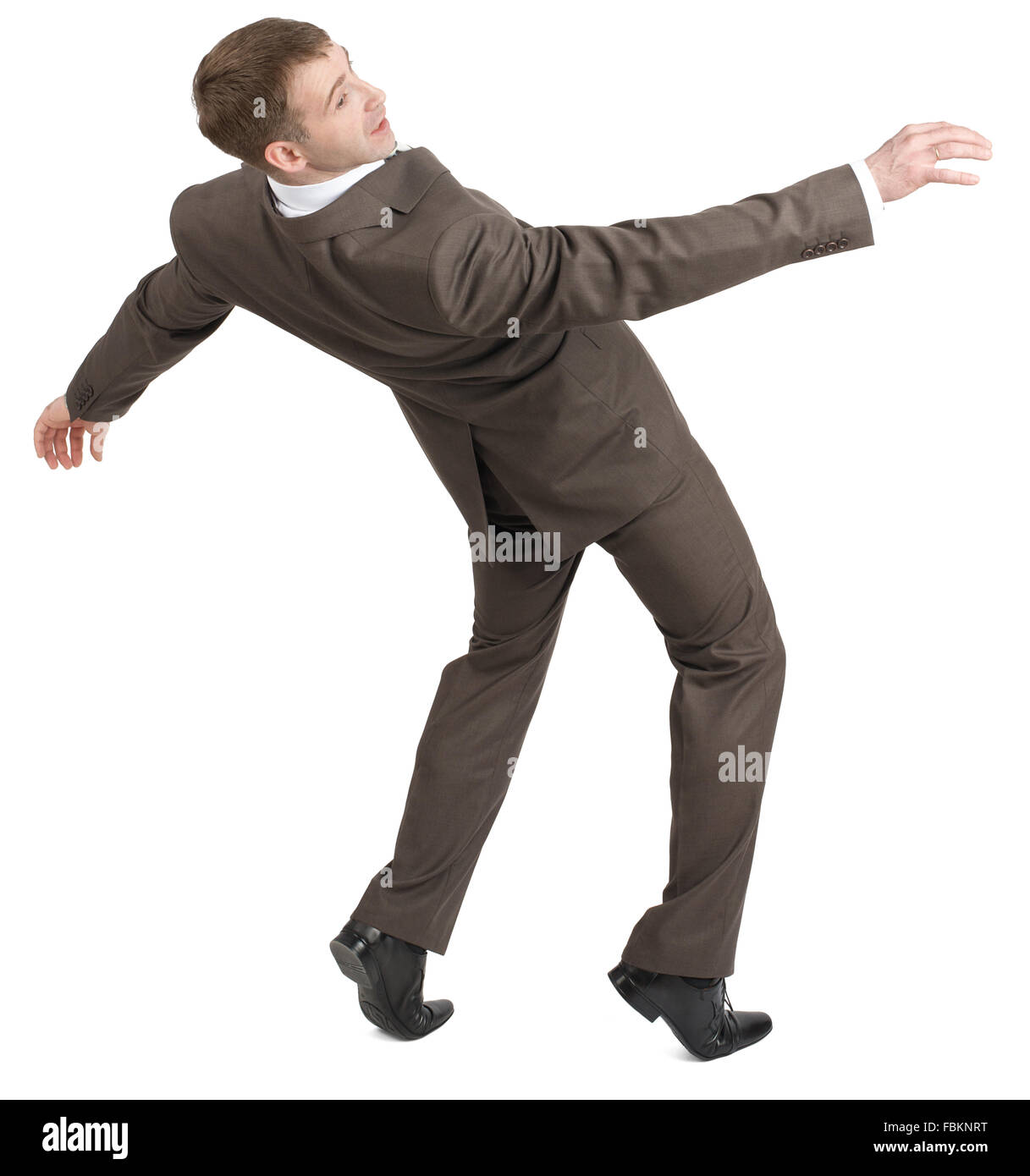 Businessman almost falling back Stock Photo - Alamy