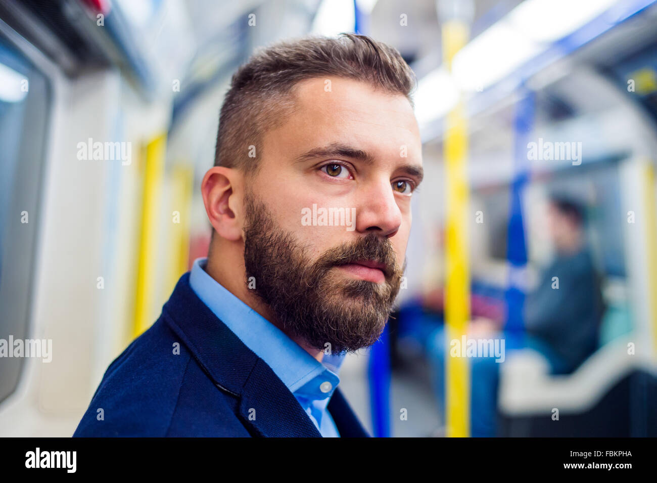 Young man in subway Stock Photo - Alamy