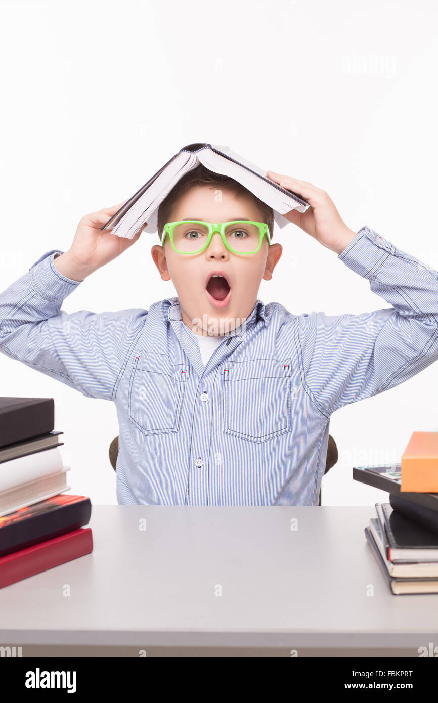 Little business boy hiding Stock Photo - Alamy